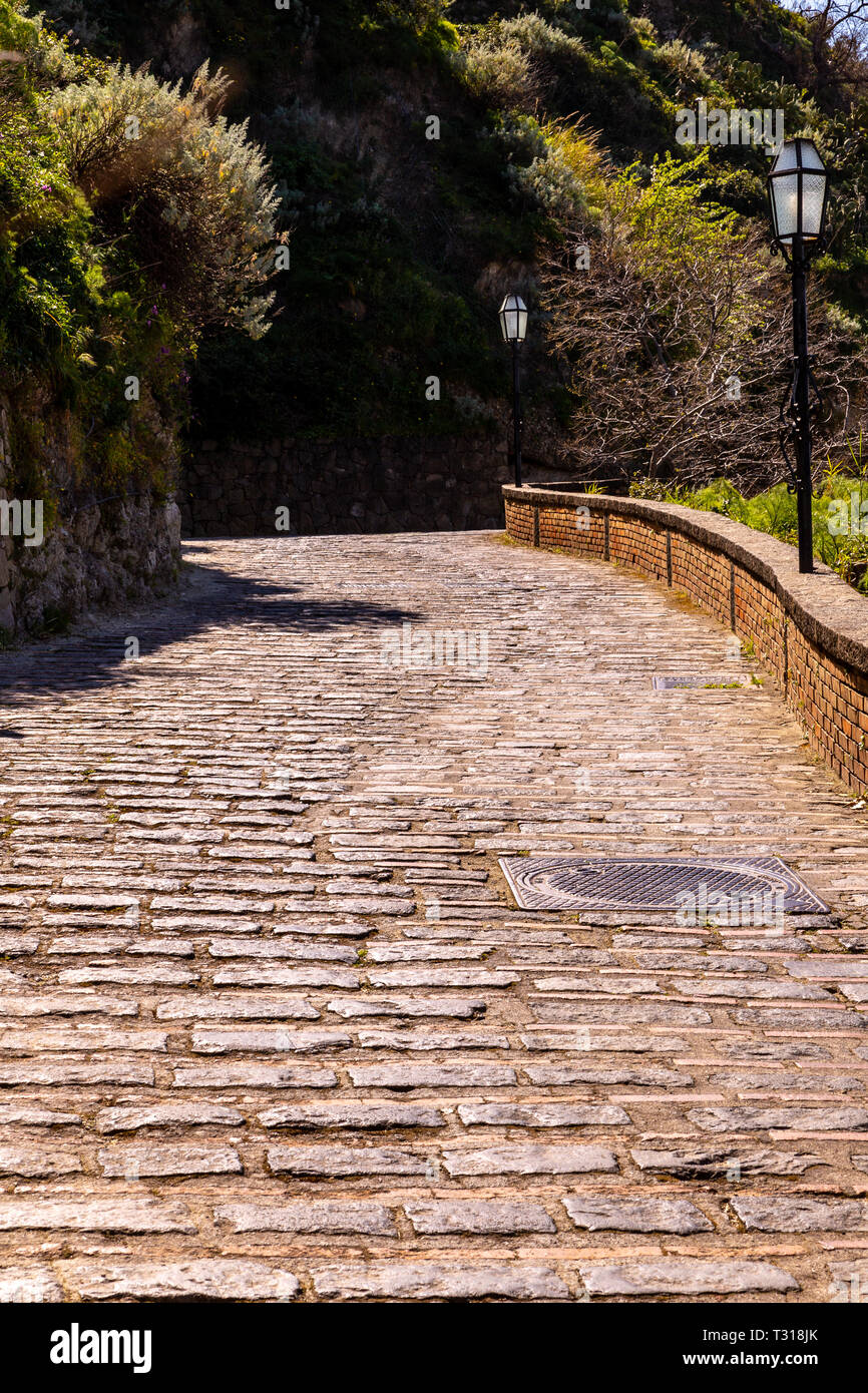 Ancient stone road that runs along a mountain Stock Photo - Alamy