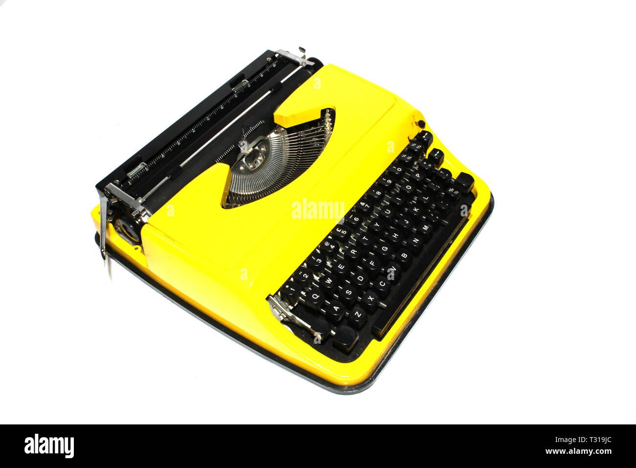 Retro Yellow Typewriter on a White Background Stock Photo - Alamy