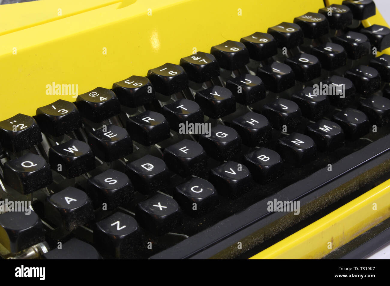 Retro Yellow Typewriter on a White Background Stock Photo - Alamy