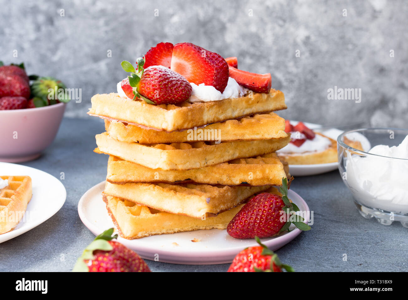 A stack of waffles with strawberries Stock Photo - Alamy