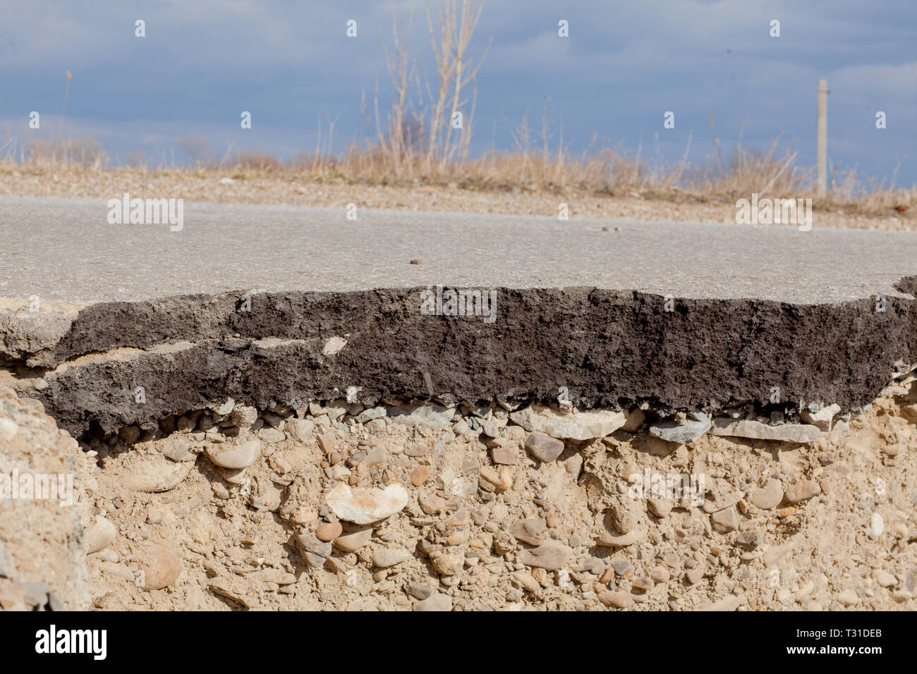 Cross section of asphalt road with blue sky background Stock Photo - Alamy