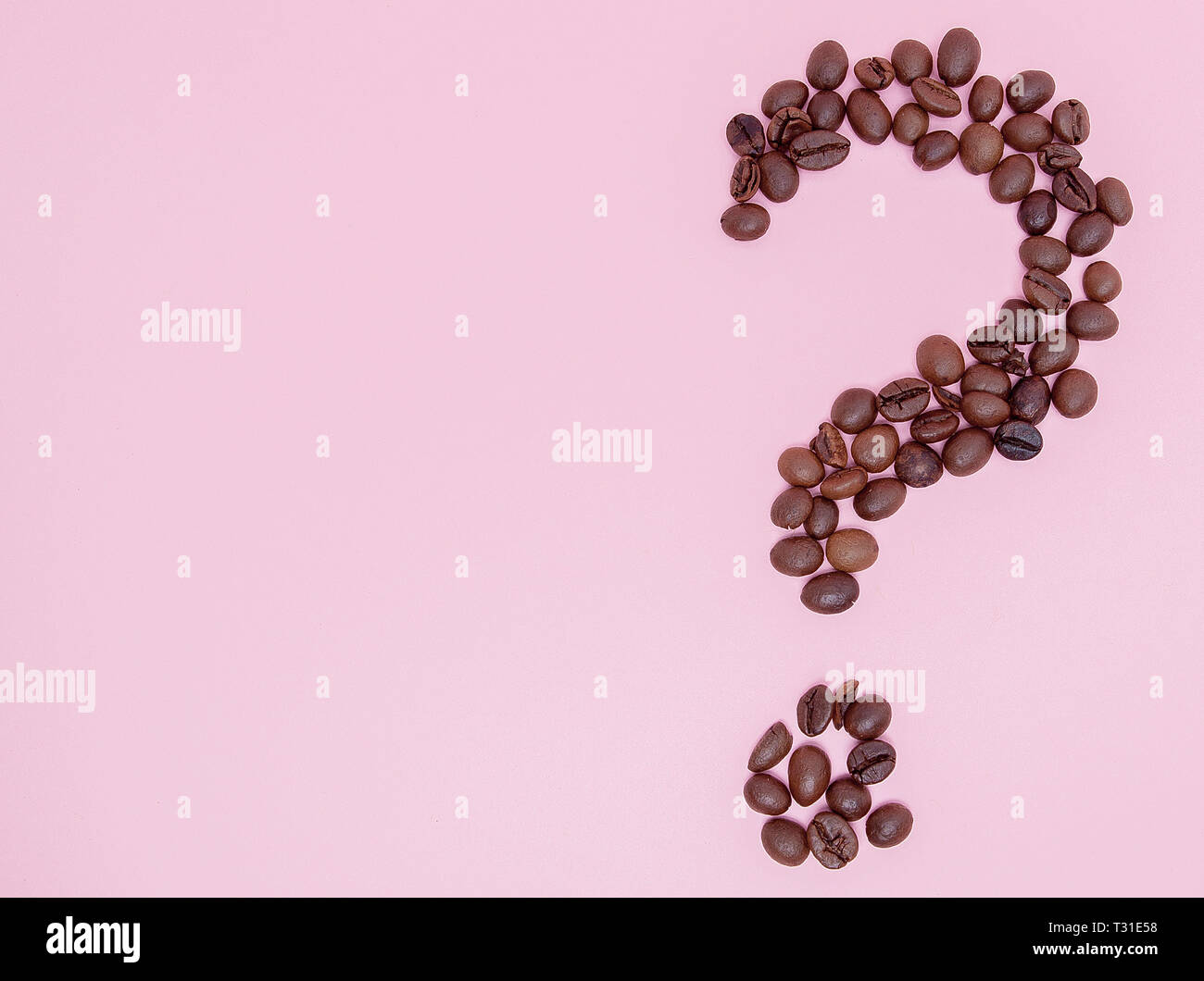 The coffee beans in shape of question mark, isolated on pink background ...