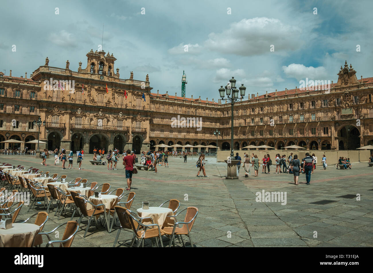 People and restaurants at the Plaza Mayor with baroque buildings in ...