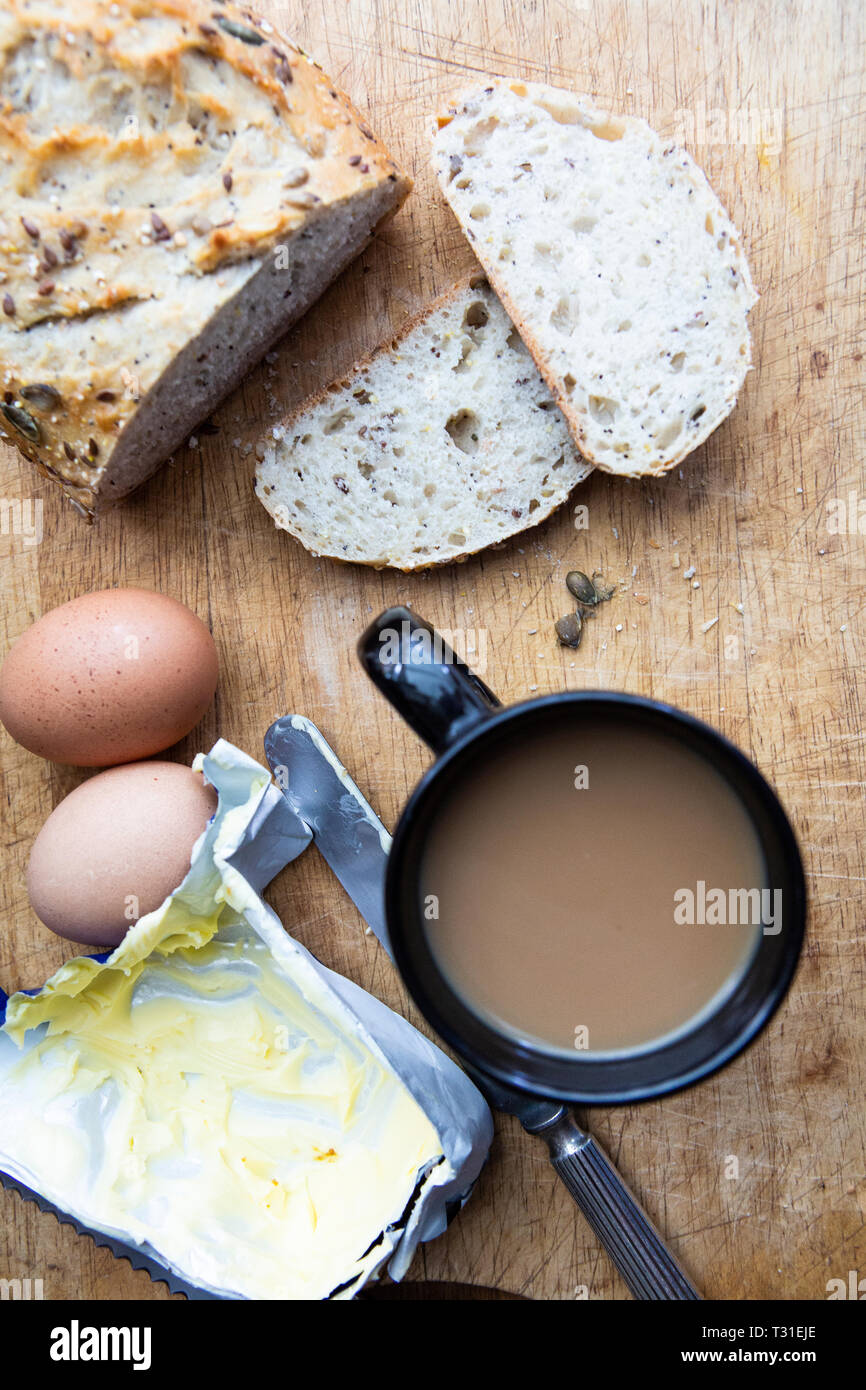 bread, eggs and coffee. Making breakfast Stock Photo - Alamy