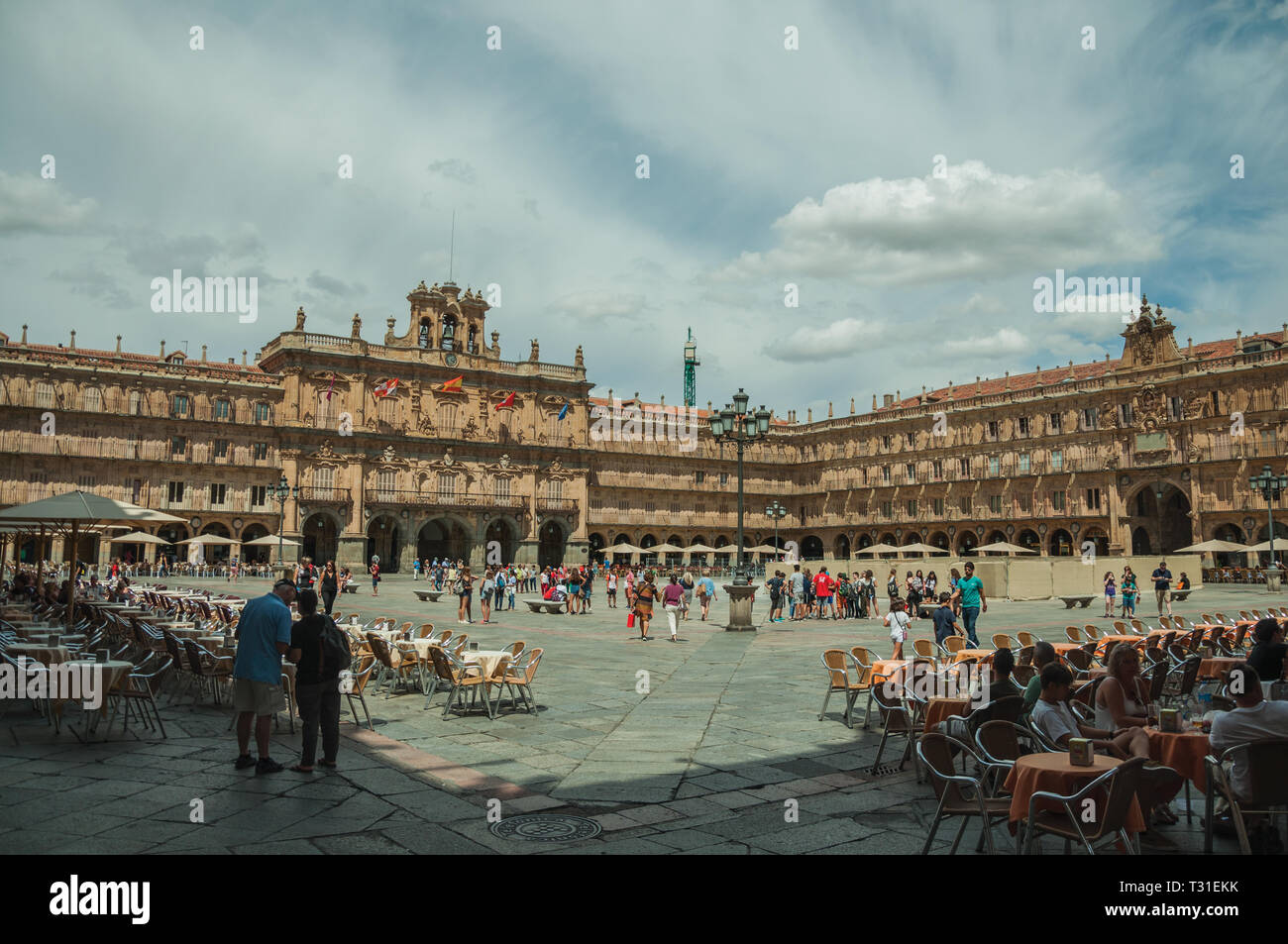 People and restaurants at the Plaza Mayor with baroque buildings in ...