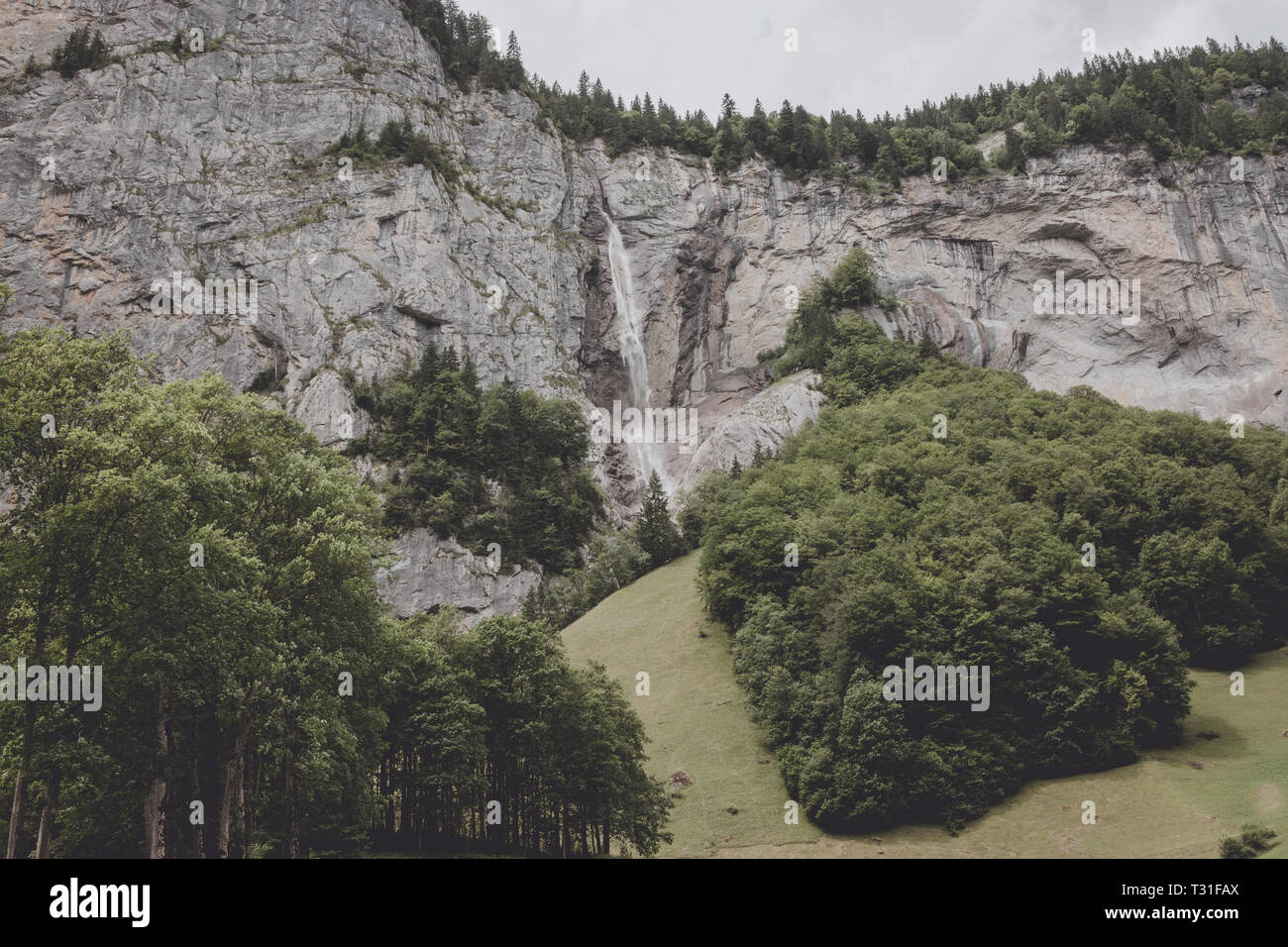View waterfall Staubbach fall in mountains, valley of waterfalls in ...