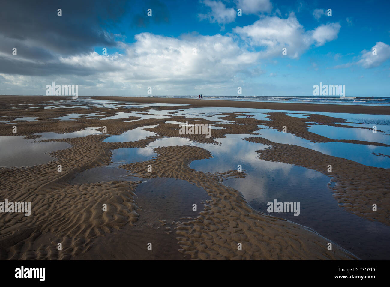 Patterns made by tide pools of water at low tide on Burnham Overy ...