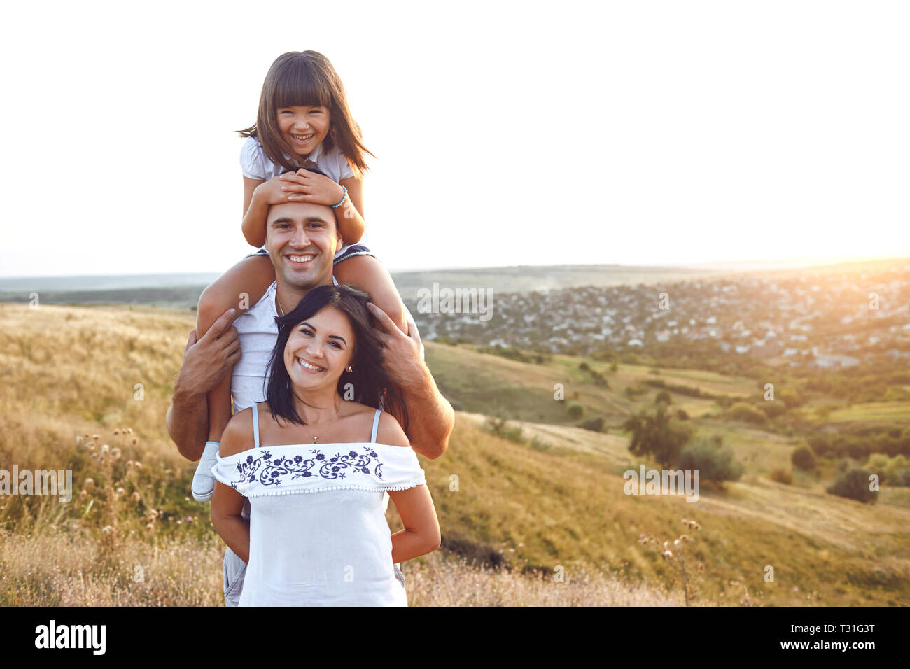 Family at sunset hi-res stock photography and images - Alamy