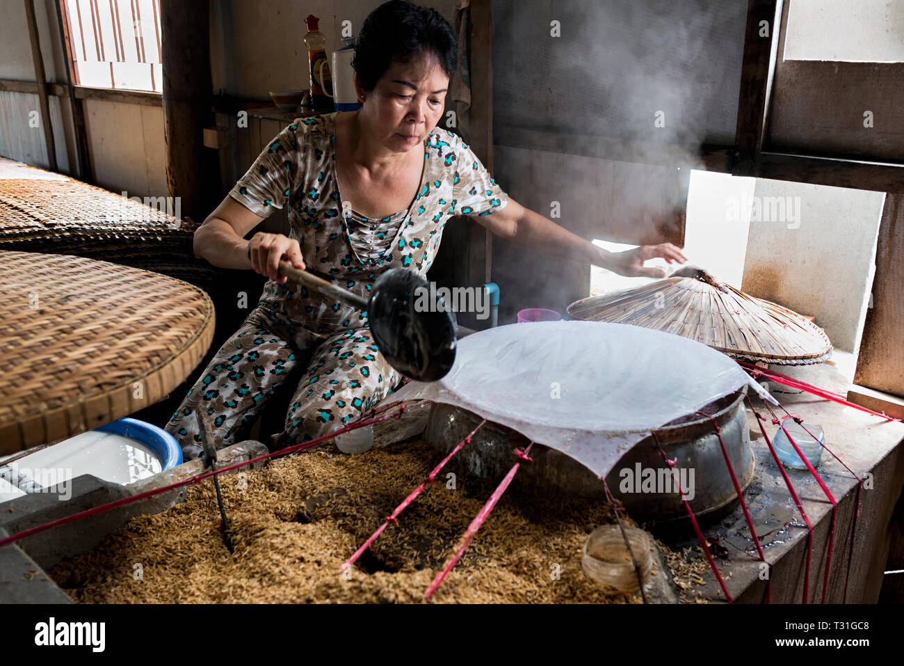 Woman making edible rice paper in Cai Be, Vietnam Stock Photo - Alamy