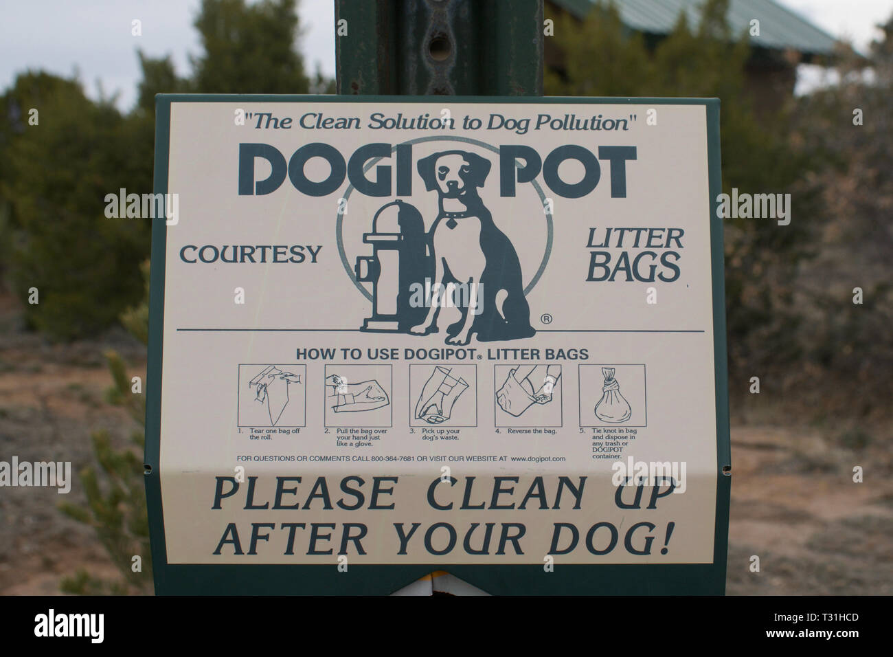 Dog Poop Cleanup Sign Stock Photo - Alamy