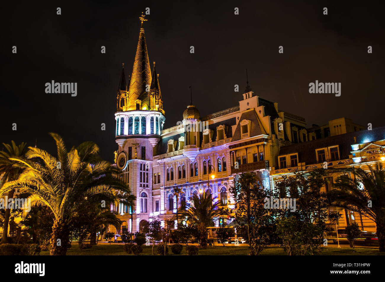 Night view of illuminated Batumi Astronomical Clock Tower building with ...