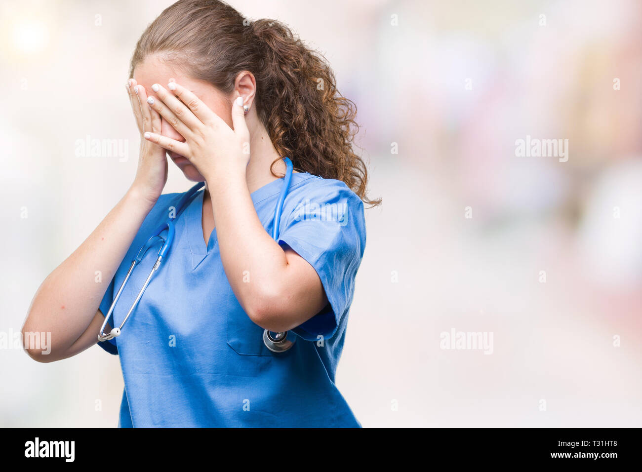 Young brunette doctor girl wearing nurse or surgeon uniform over ...