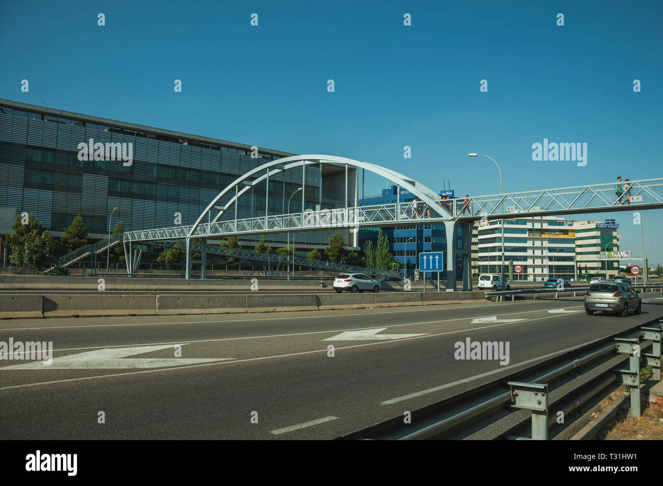 Iron footbridge for pedestrians over highway with heavy traffic in ...