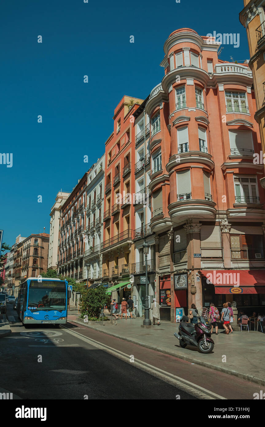 Old buildings with shops and people walking on a busy street, in a ...