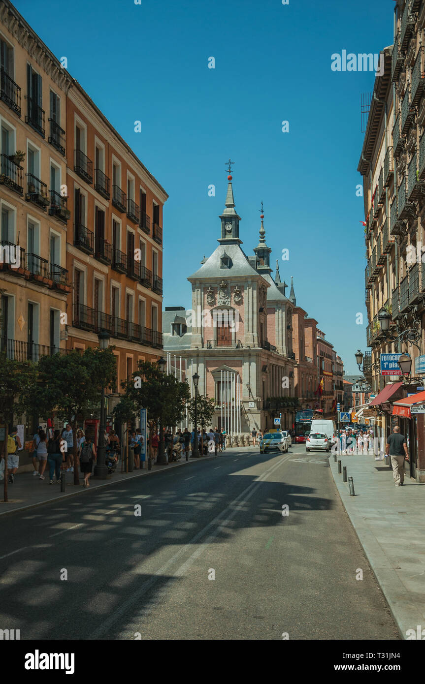 Charming old buildings with shops and people walking on a busy street ...