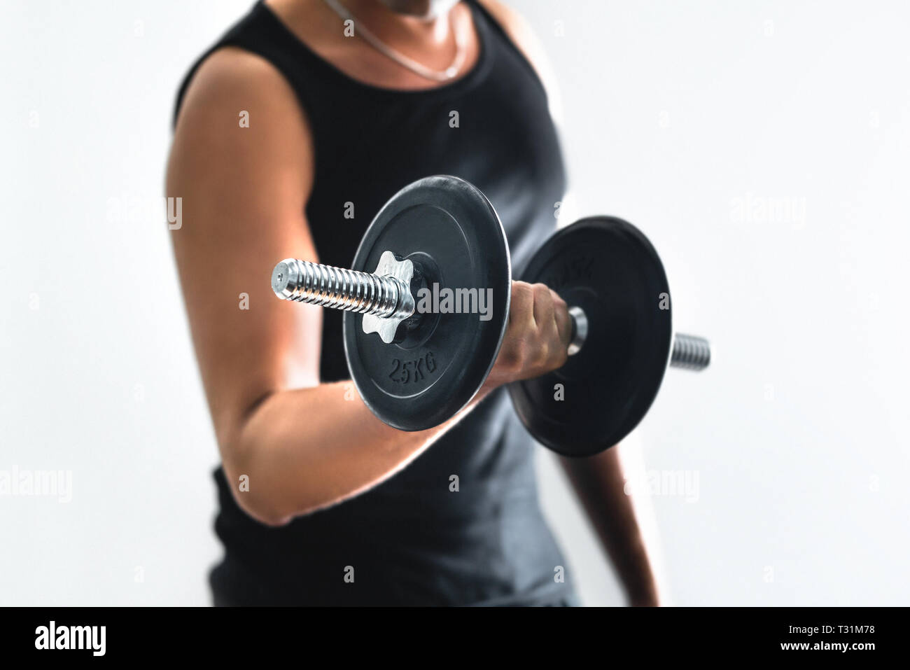 Man Training Arms And Doing Bicep Curls With Dumbbell Guy Working Out