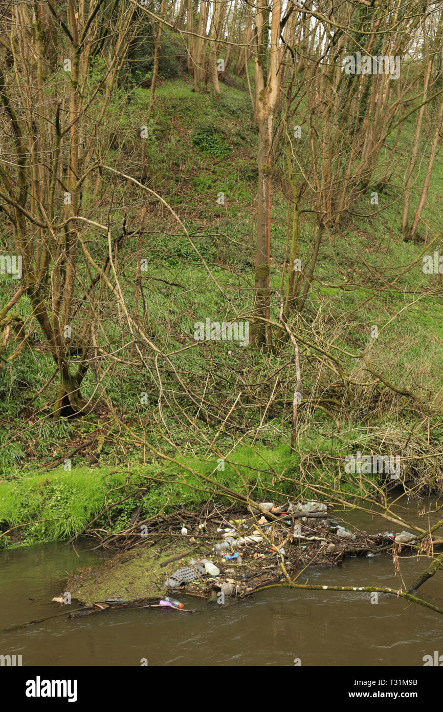 Plastic waste floating in a UK stream Stock Photo - Alamy