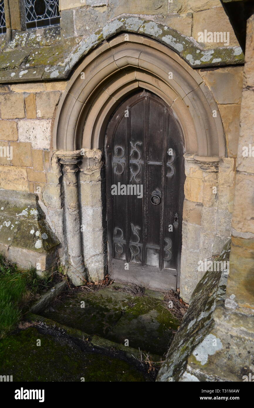 All Saints Church Rudston - Arch Side Door - East Yorkshire - UK Stock ...