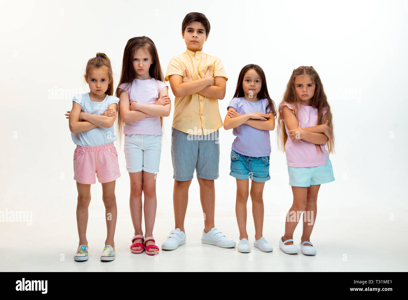 The portrait of happy cute little kids boy and girls in stylish casual ...