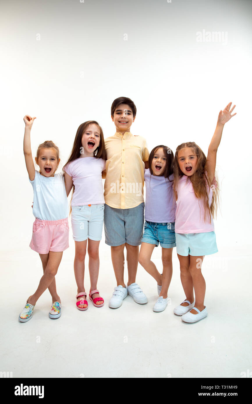 The portrait of happy cute little kids boy and girls in stylish casual ...
