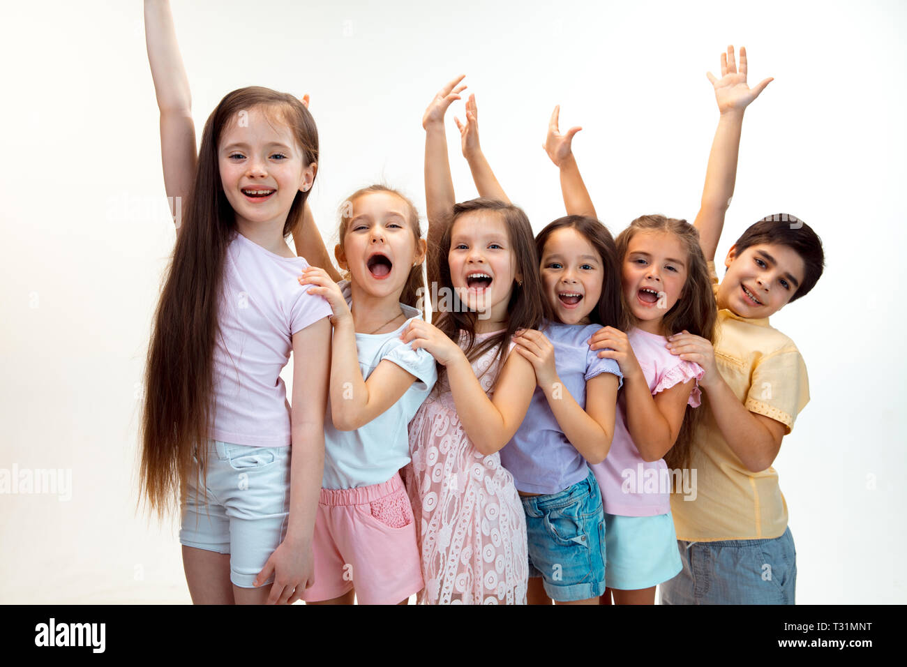 The portrait of happy cute little kids boy and girls in stylish casual ...
