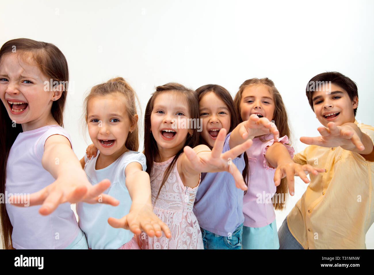The portrait of happy cute little kids boy and girls in stylish casual ...