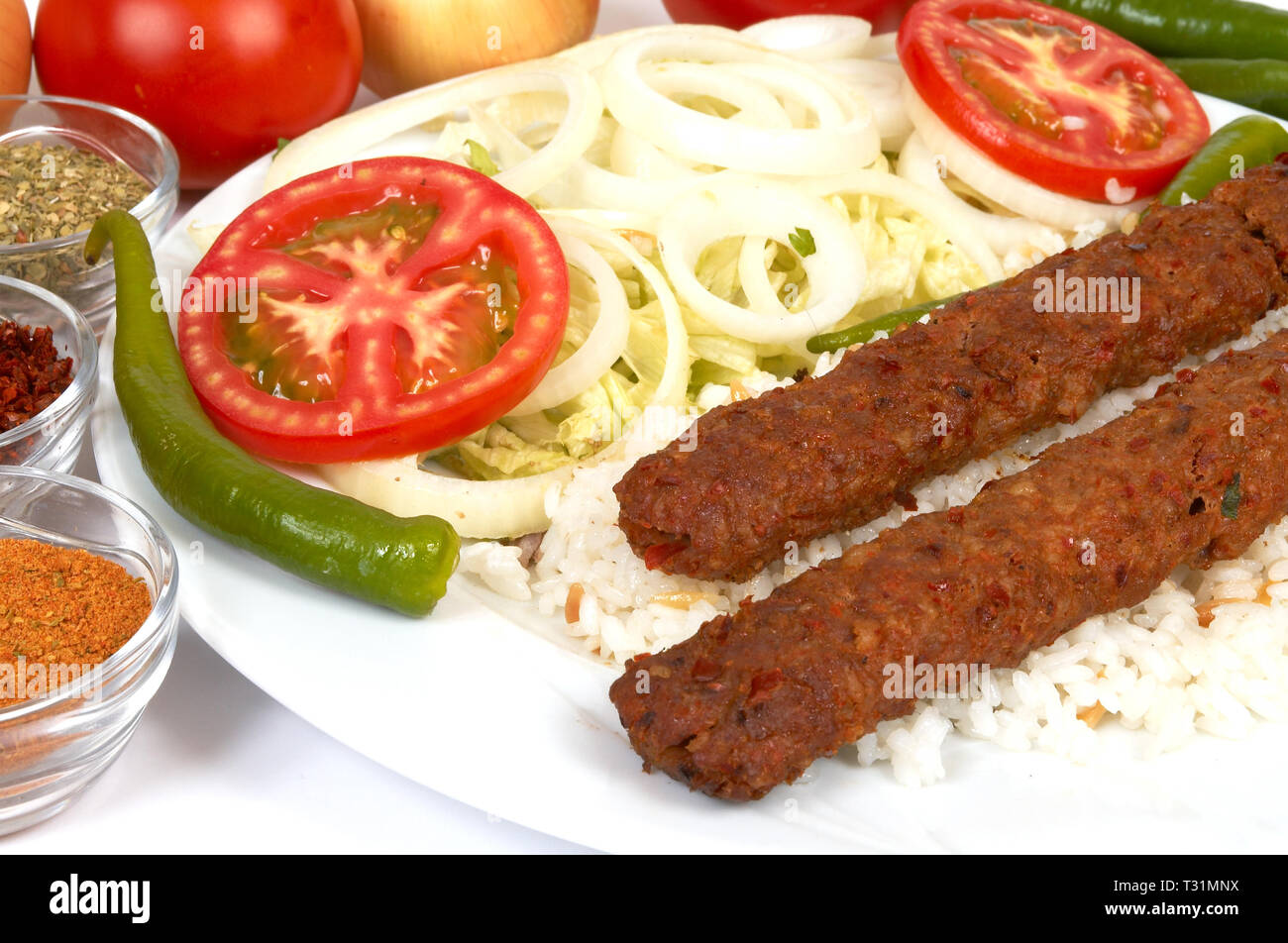 Adana kebap with rice and salads Stock Photo - Alamy