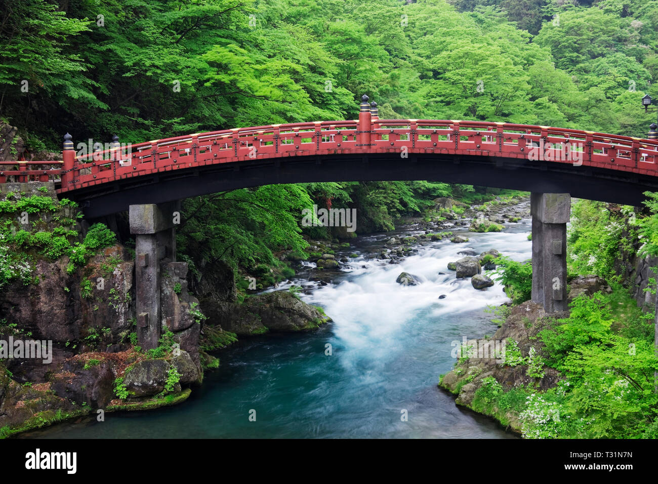 Asian Bridge Crossing a River Stock Photo - Alamy