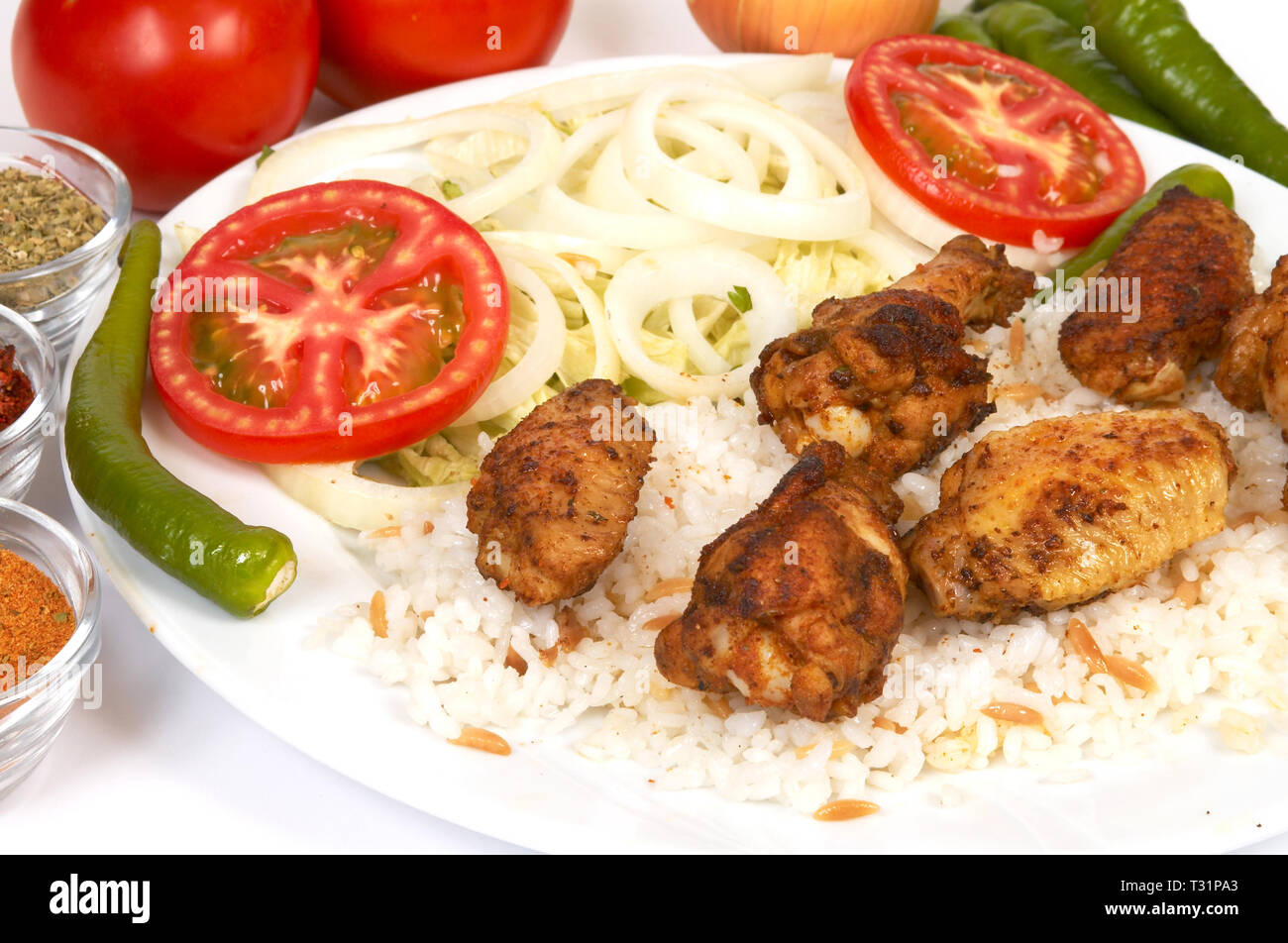 Chicken wings with rice and salads Stock Photo - Alamy