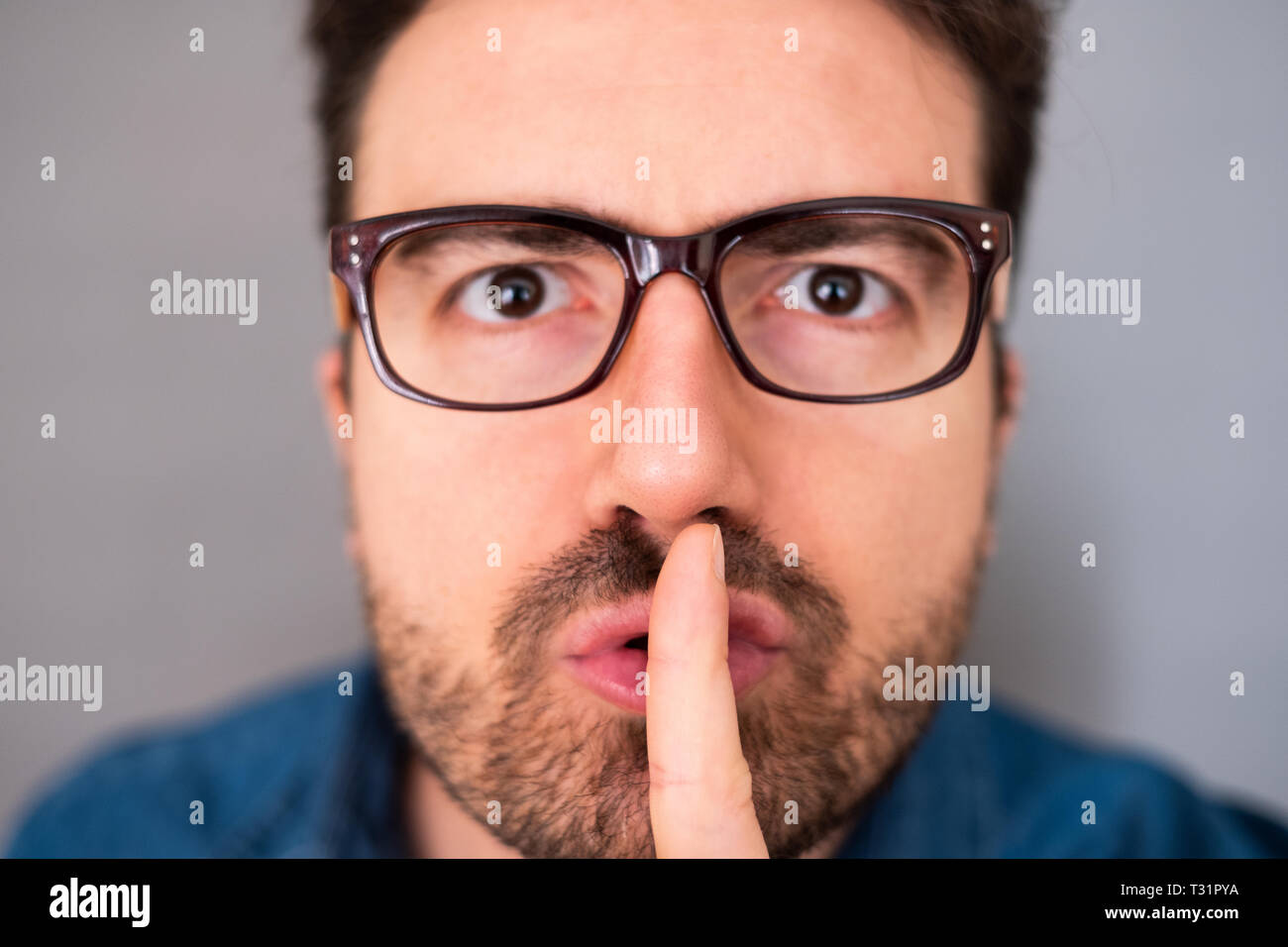 Confidential expression hi-res stock photography and images - Alamy