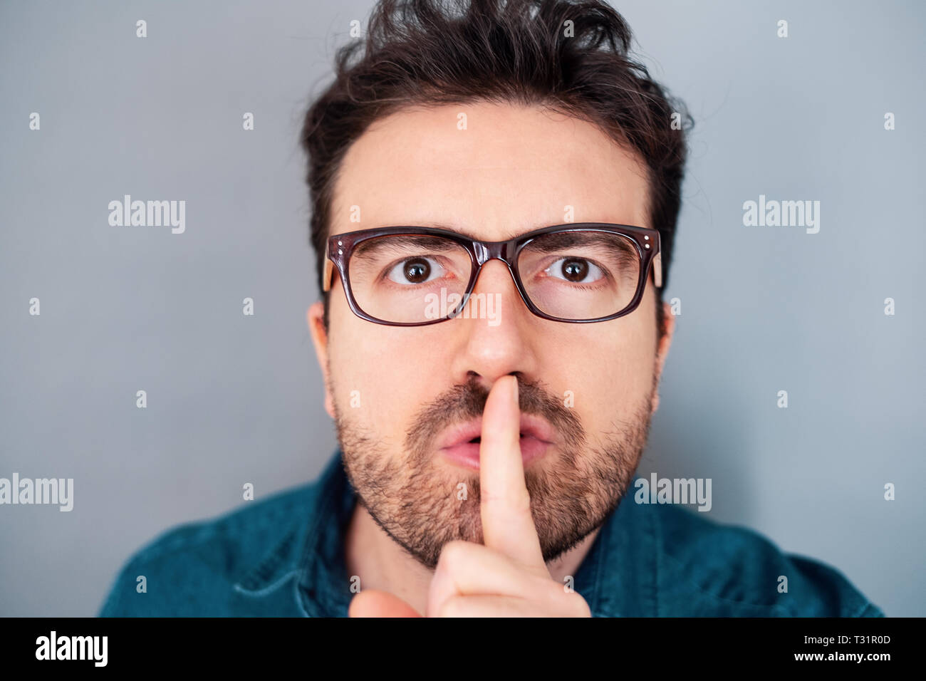 Confidential expression hi-res stock photography and images - Alamy