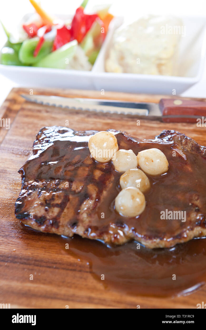 Meat garnished with chocolate sauce Stock Photo - Alamy
