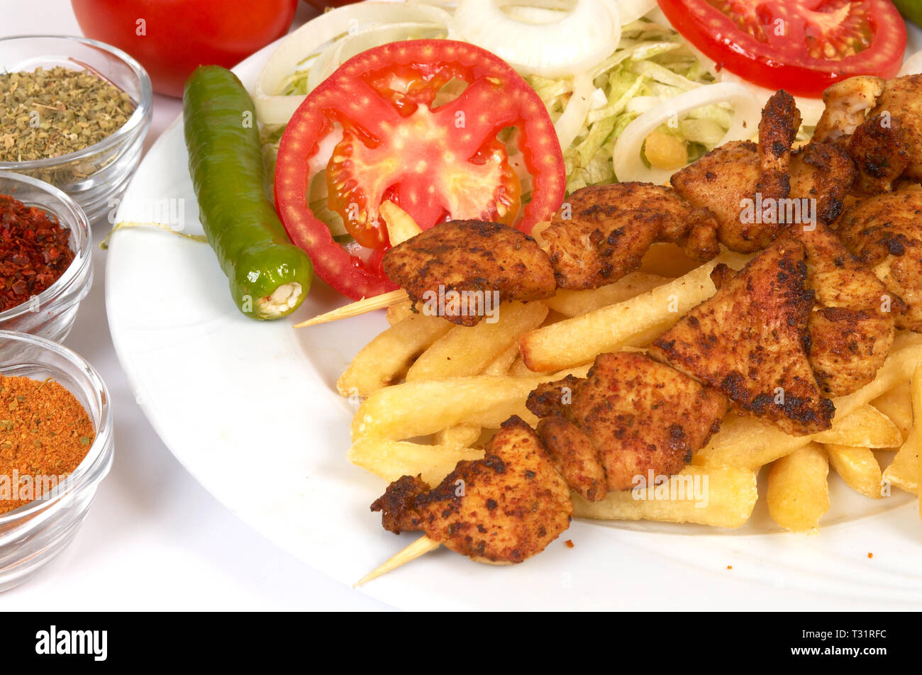 Chicken fillet ready to serve with french fries and salads Stock Photo ...