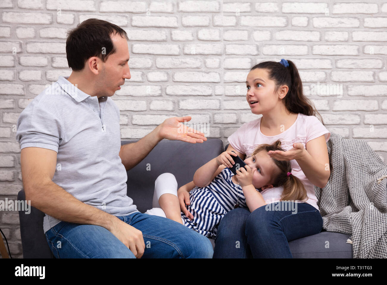 Mother and daughter arguing with father hi-res stock photography and ...