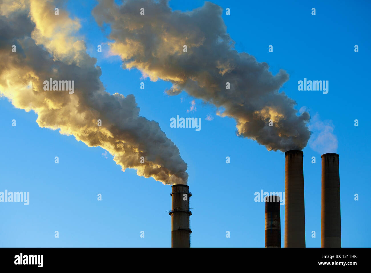 Smoke emitting from factory smoke stacks Stock Photo - Alamy