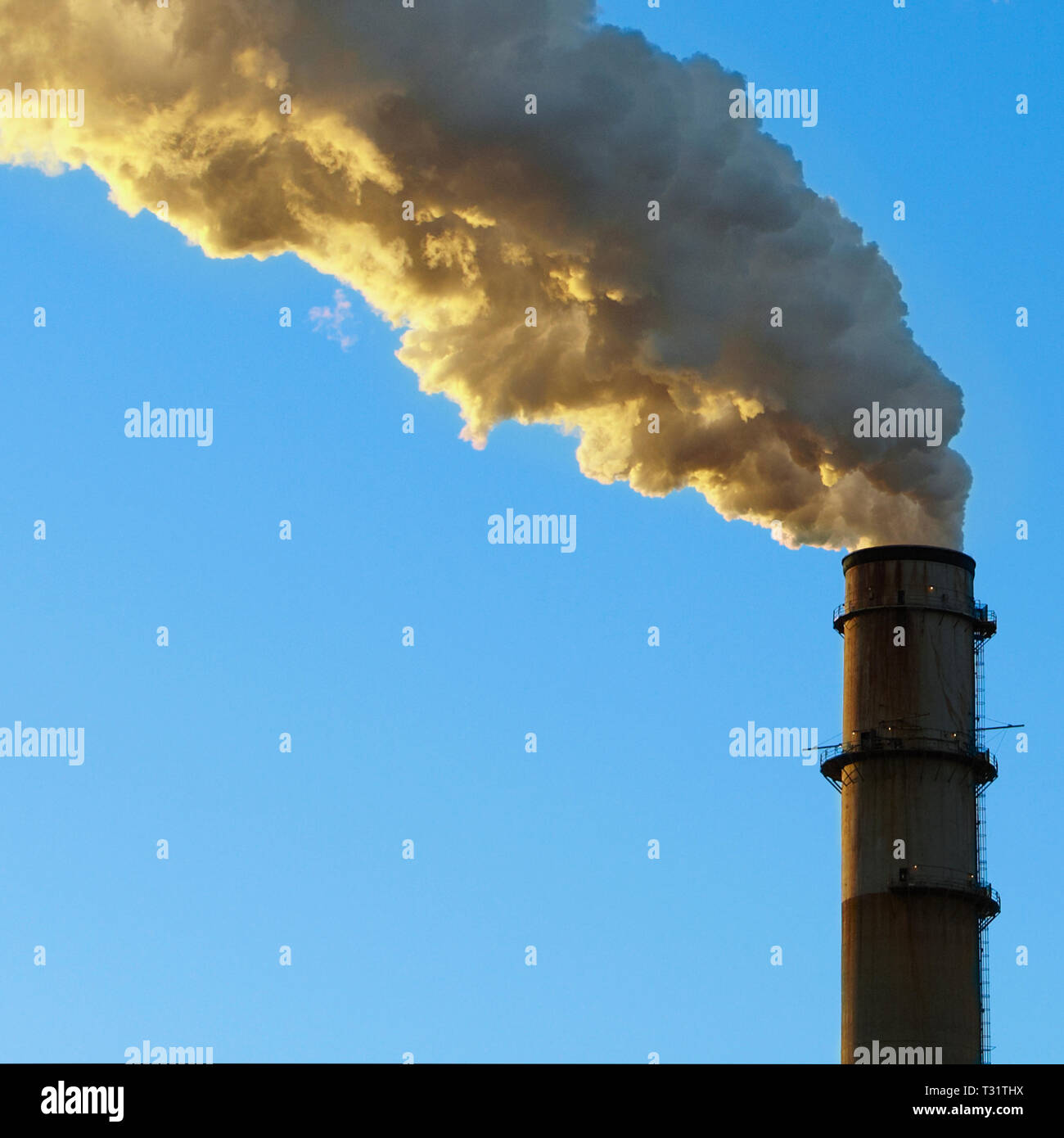 Smoke emitting from factory smoke stack Stock Photo - Alamy