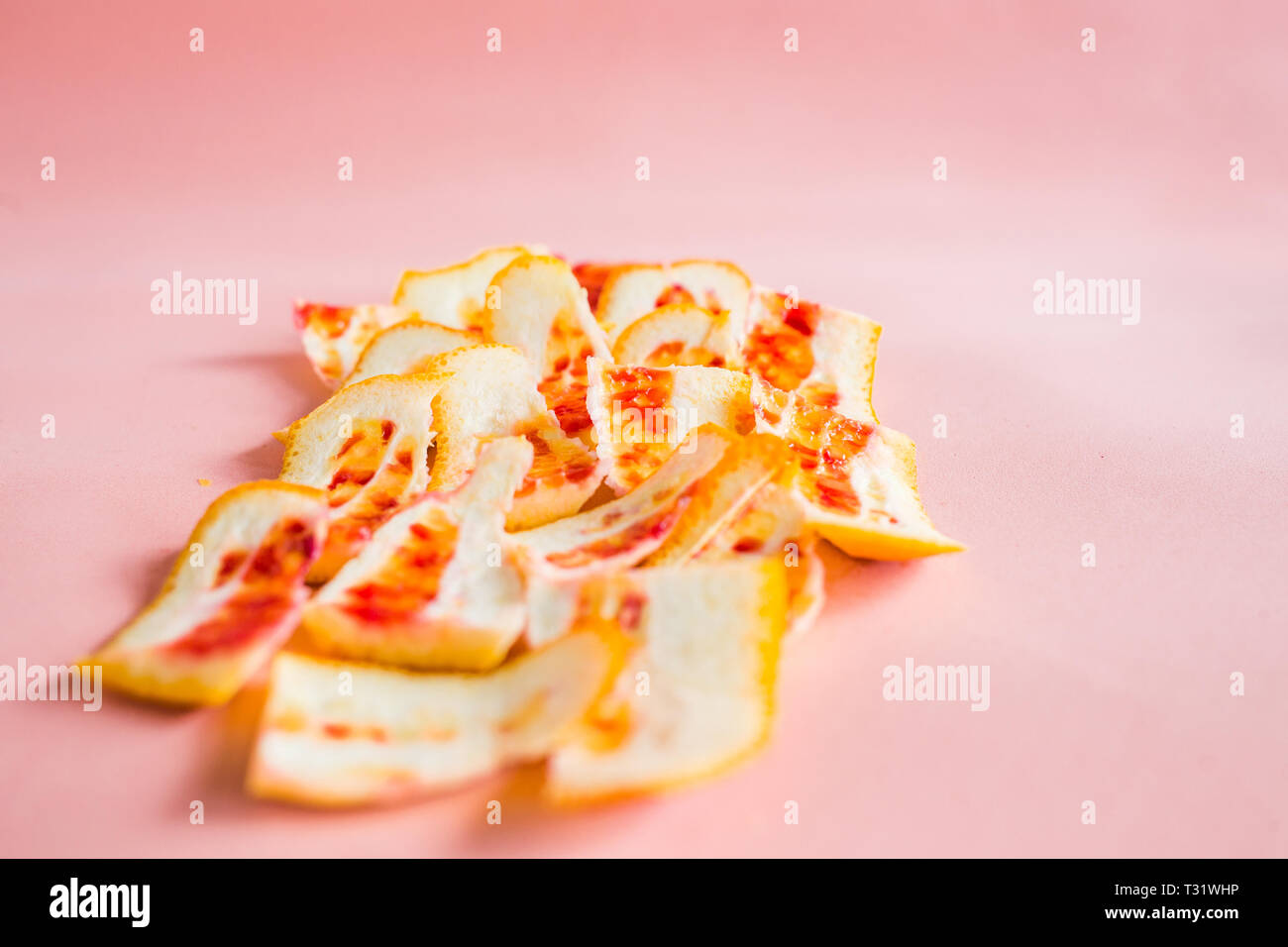 colorful orange rind isolated on pink background Stock Photo - Alamy