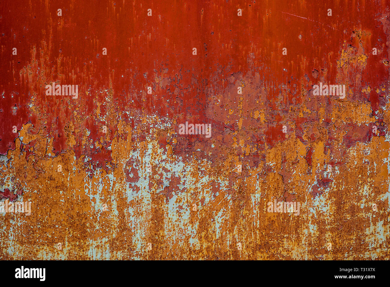 Texture of old rusty metal, painted red which becames orange from rust ...