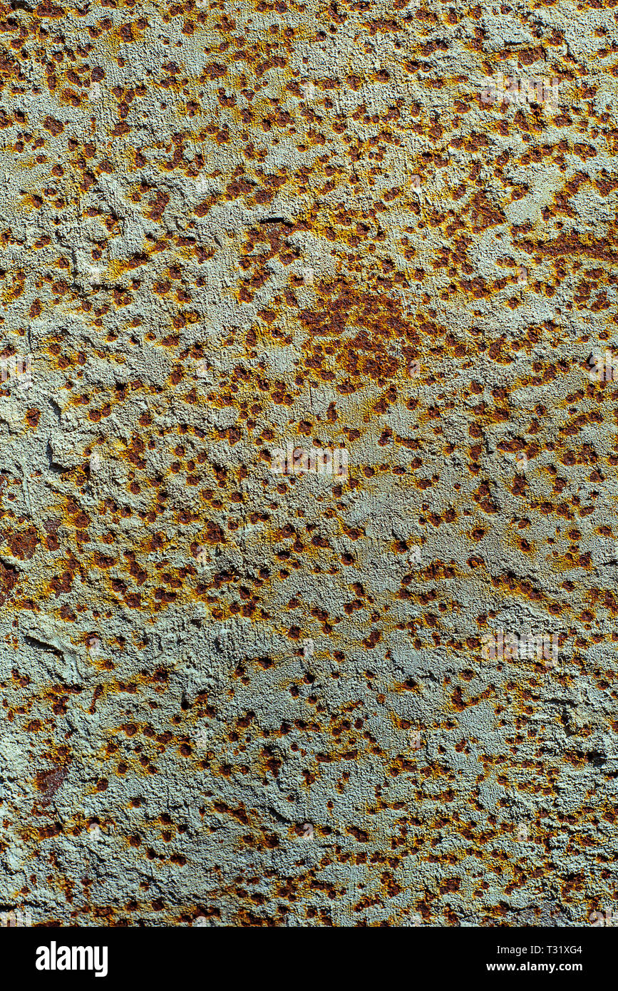 Old rusty metal, painted grey which becames orange dots from rust ...