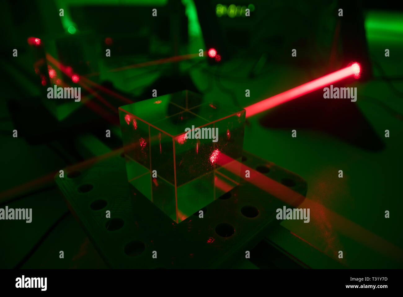 Experiment with a red laser in a physics lab Stock Photo - Alamy