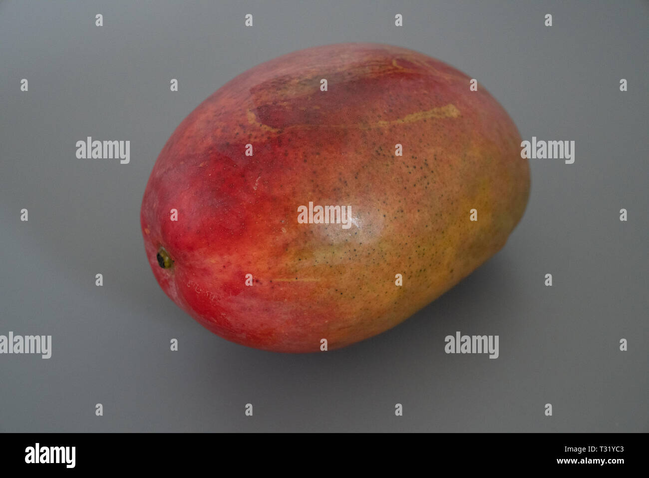 Mango fruit on dark background Stock Photo - Alamy