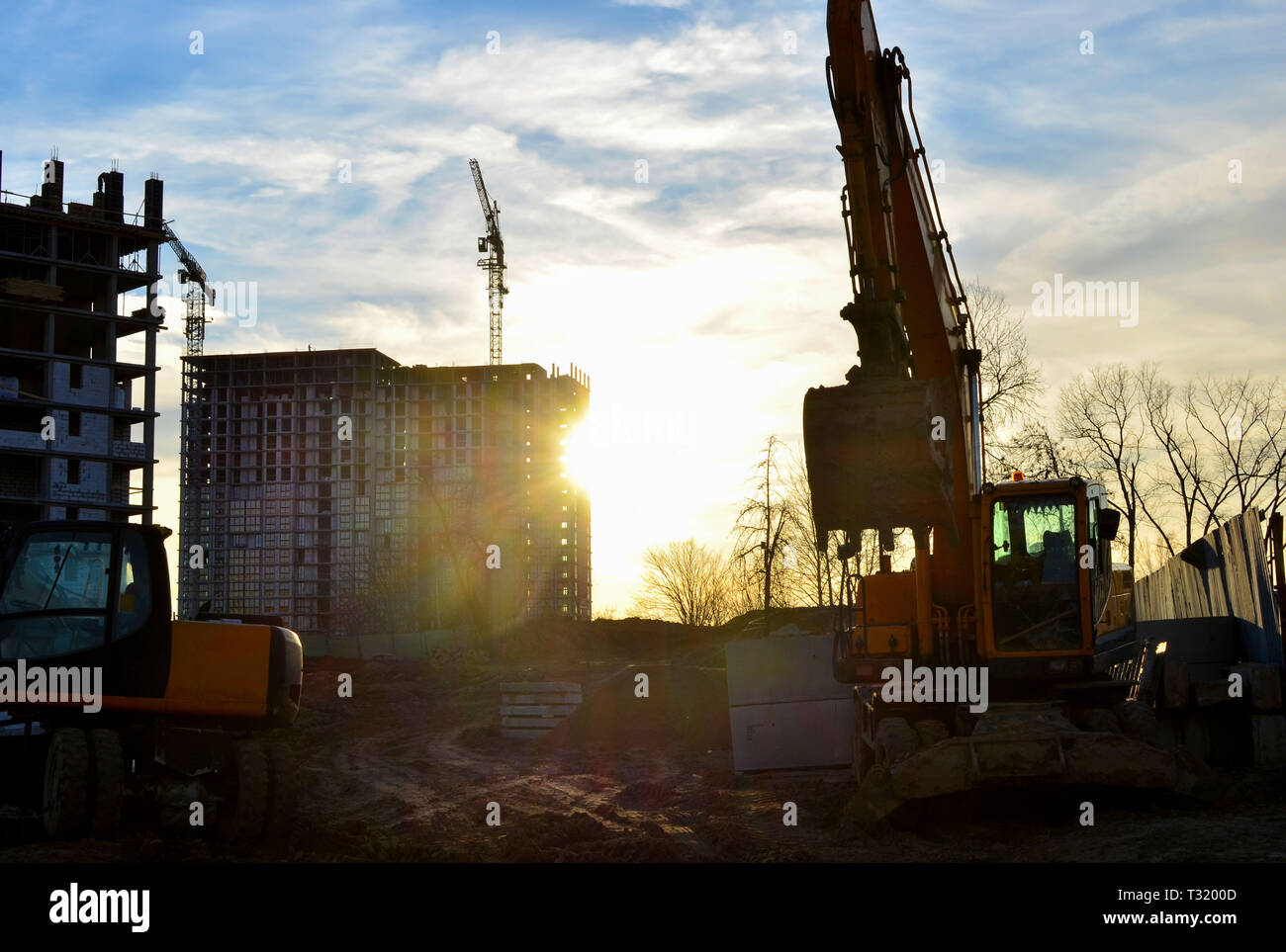 Tracked excavator with raised bucket. Construction earthmoving ...