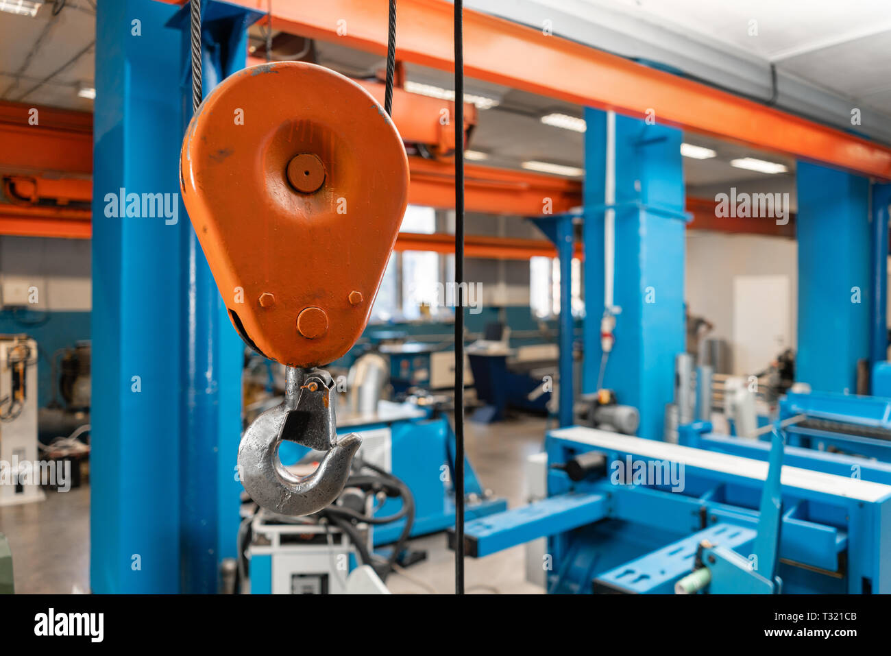 Crane hook. The system of pulleys and ropes, a hanging mechanism in the ...