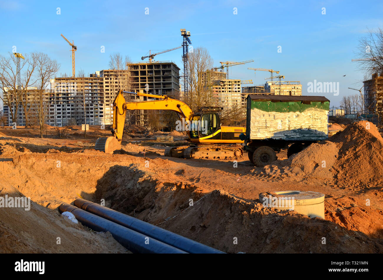 Installation of heat pipes of the heating network. Sewer pipes in ...