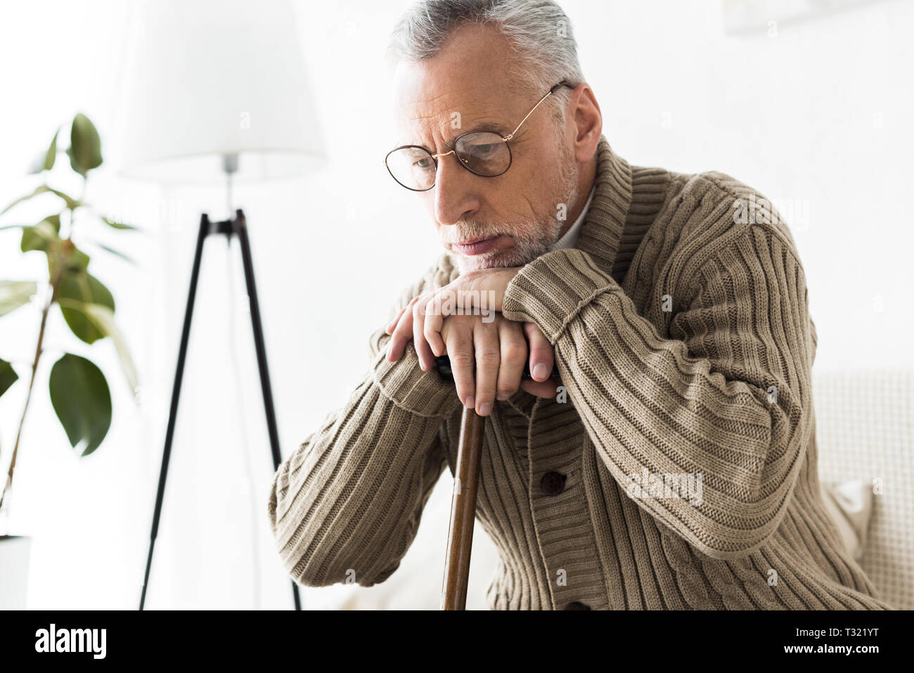 Thoughtful retired man walking hi-res stock photography and images - Alamy