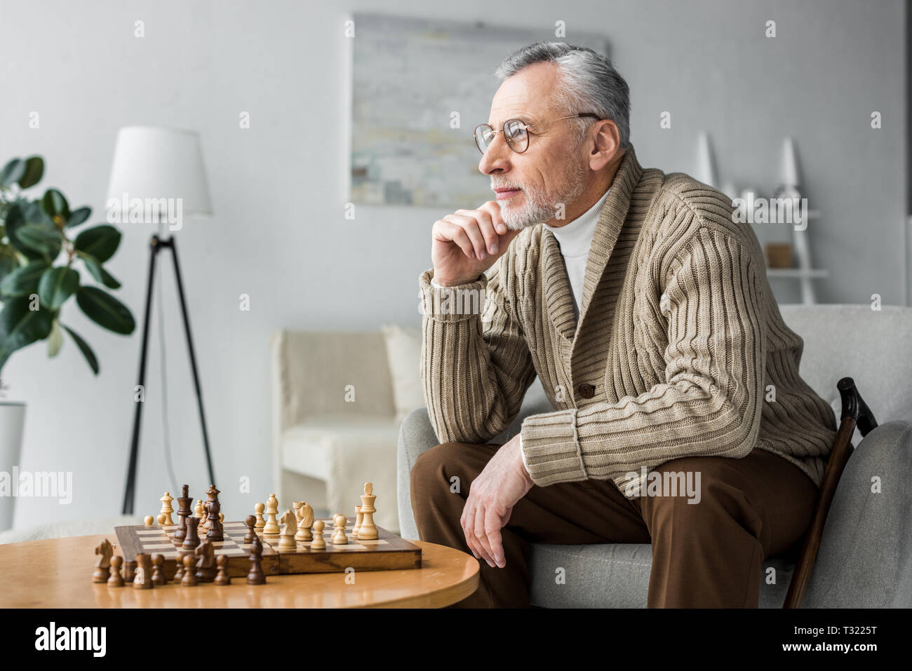 Retired man thinking in home hi-res stock photography and images - Alamy