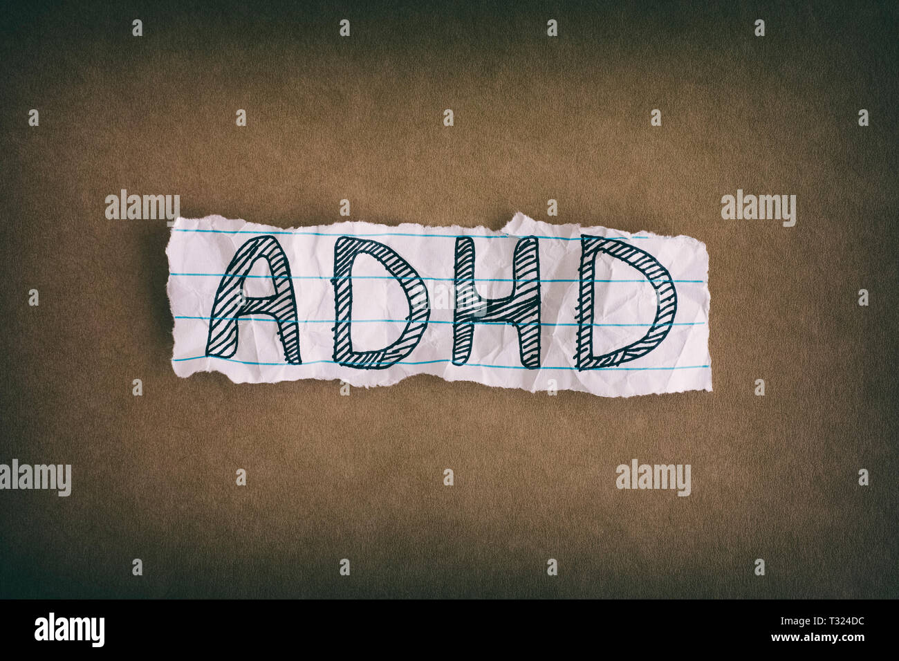 ADHD. Abbreviation ADHD on brown background. Close up. ADHD is ...