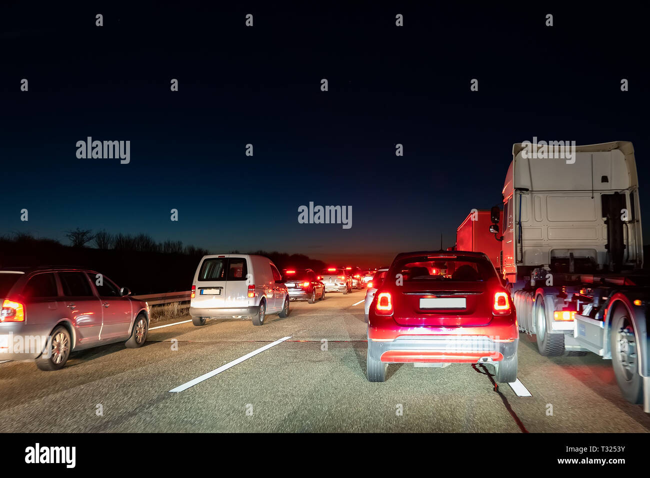 Rescue lane of highway in the night Stock Photo - Alamy