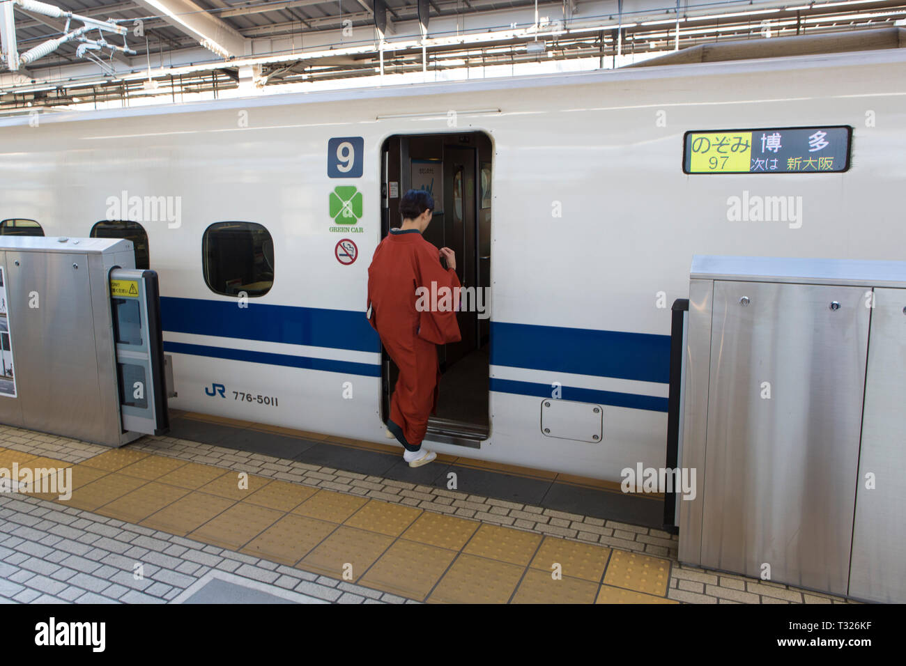 Man boarding bullet train Stock Photo - Alamy