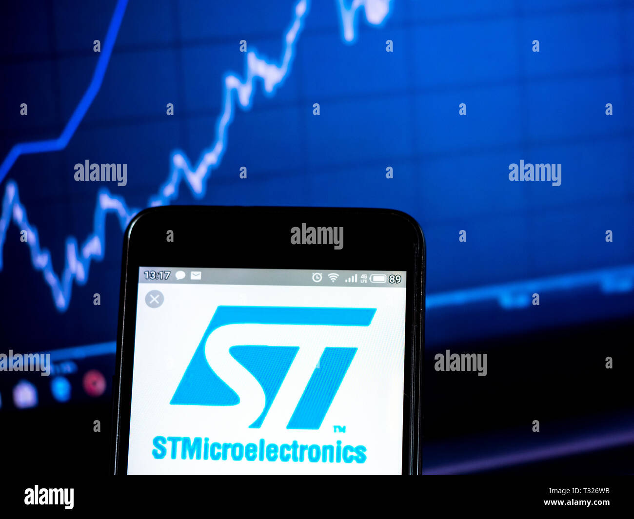 In this photo illustration a STMicroelectronics logo seen displayed on ...